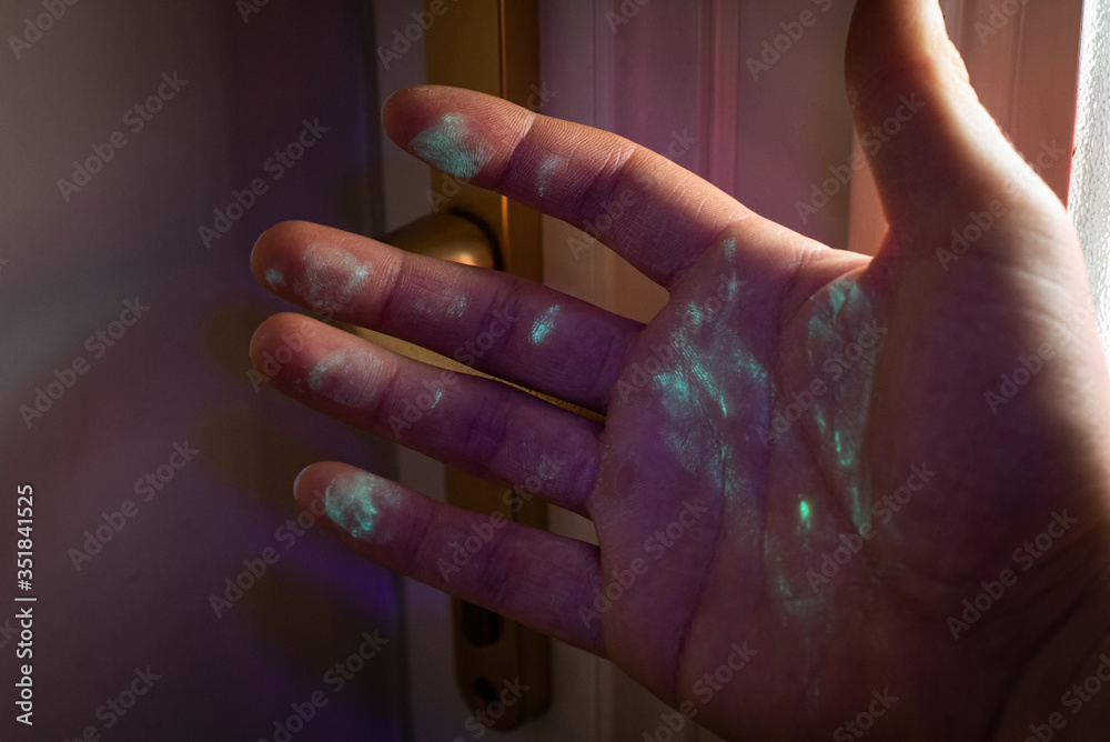 hand covered in bacteria or virus after touching door handle ...