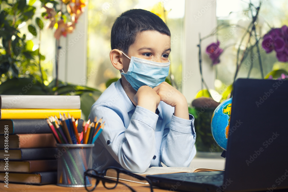 Kid self isolation using laptop for his homework,Child doing using ...