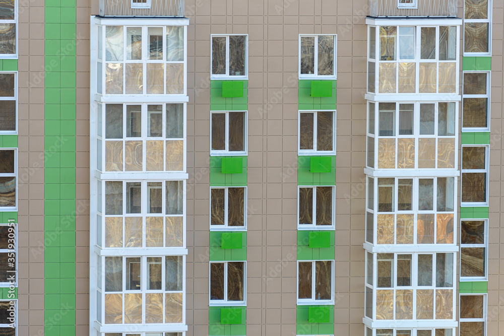 Facade of a tall residential building. High-rise buildings modern ...