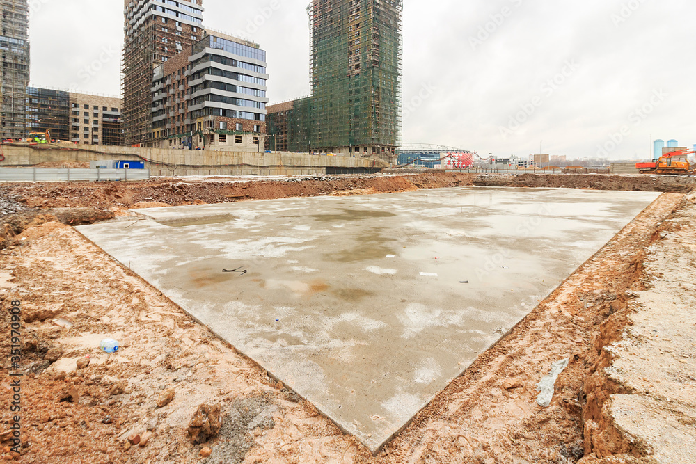 Pile driving in foundation pit for construction of apartment building ...