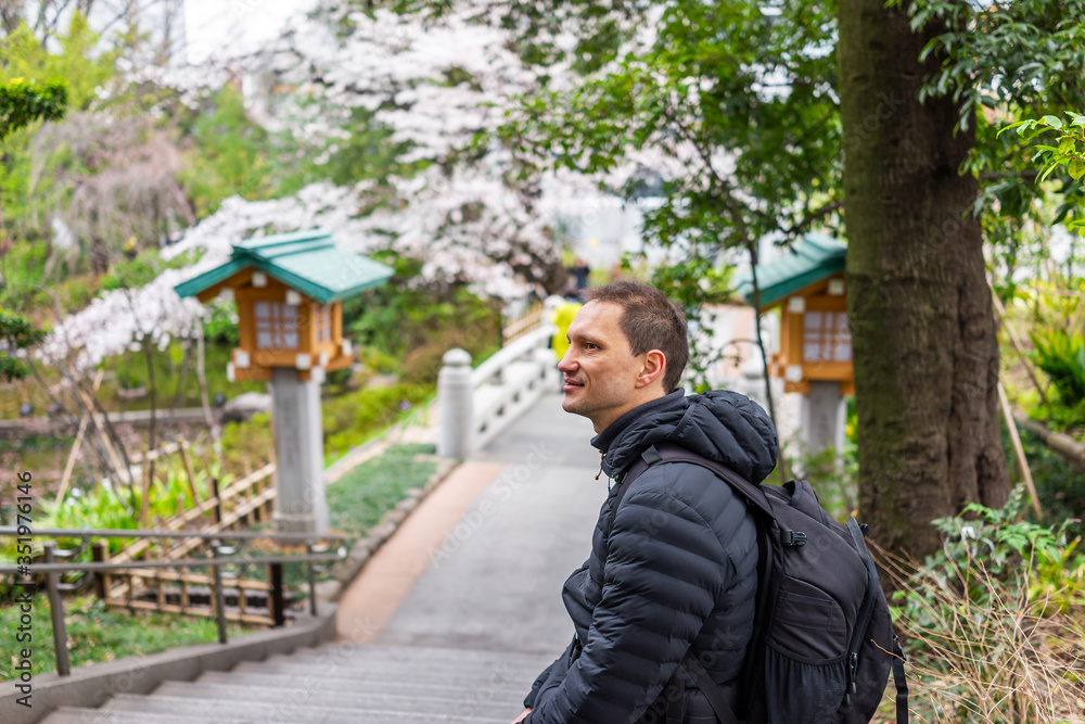 Tokyo, Japan Togo shrine temple garden with one foreigner tourist man ...