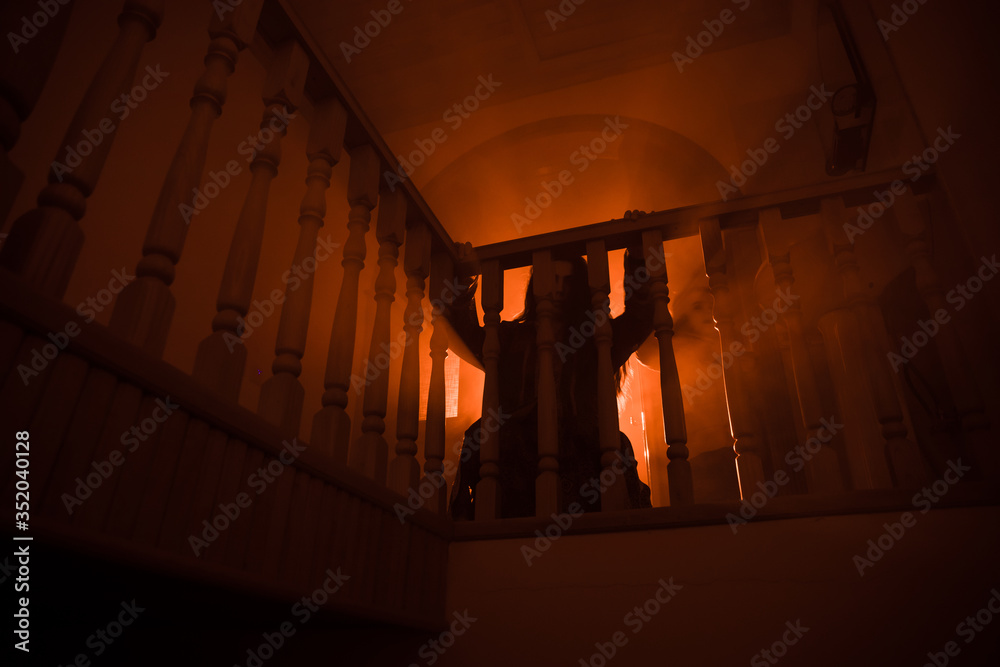 Inside of old creepy abandoned mansion. Silhouette of horror ghost ...
