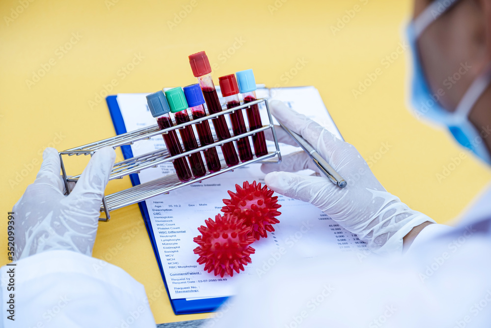Lab personnel hand recording the blood test results Stock Photo | Adobe ...
