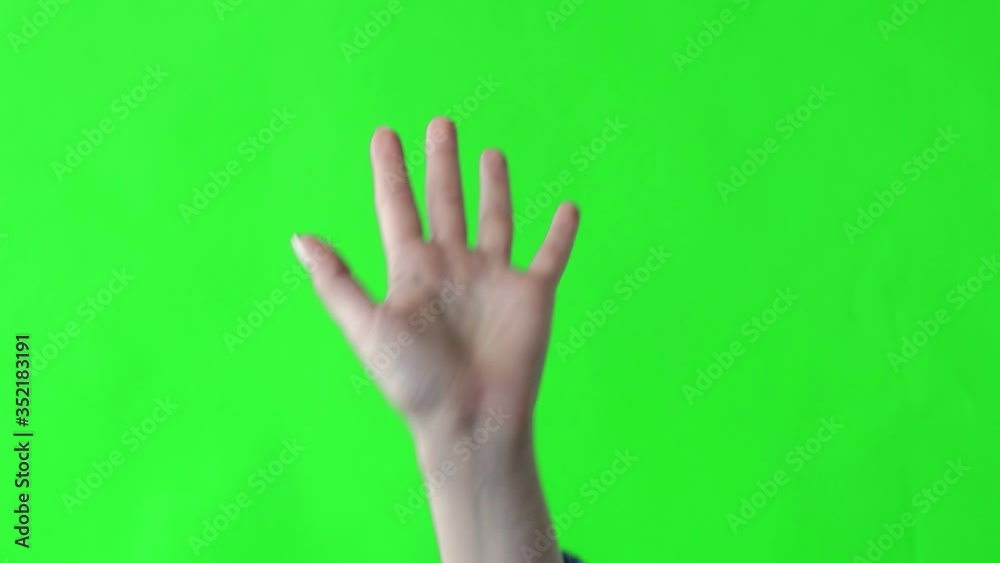 Hand woman waving hello or goodbye on green screen background Stock ...