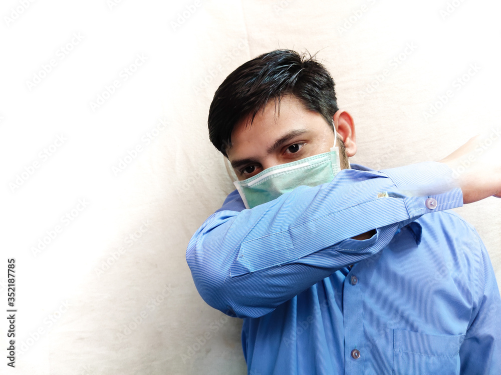 Man coughing wearing mask using elbow, Indian White background Stock ...