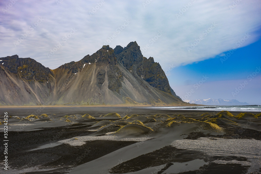 Icelands Vestraborn and Brunnhorn mountain rise out of the ocean oand ...