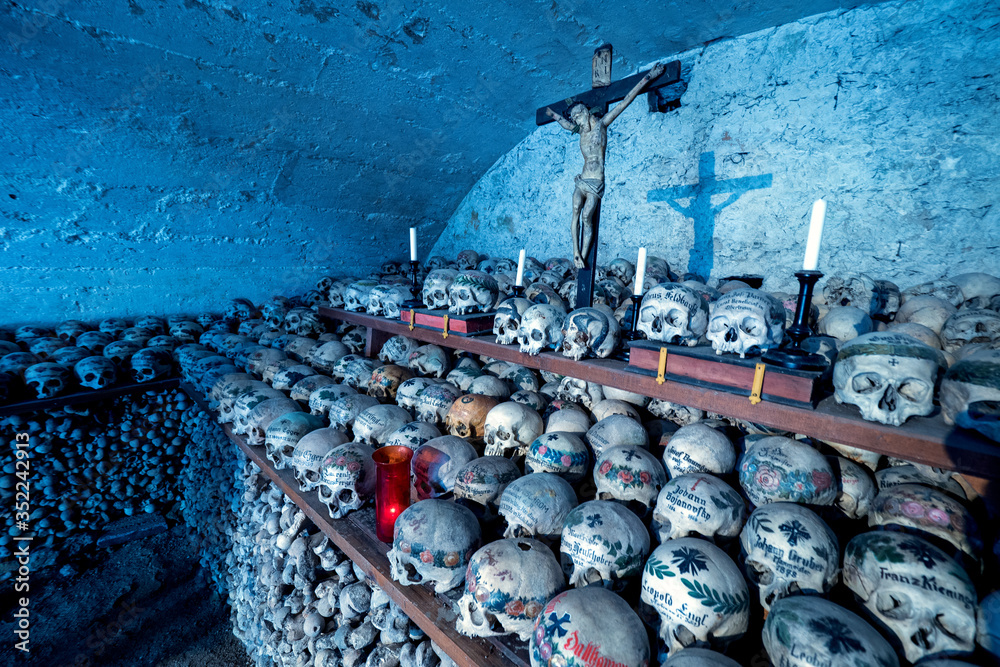 View of hundreds of painted skulls and bones inside the famous charnel ...