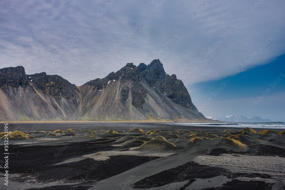 Icelands Vestraborn and Brunnhorn mountain rise out of the ocean oand ...
