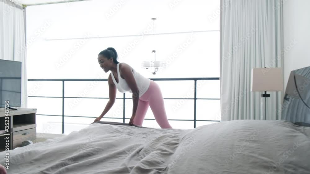 1 Multiethnic Couple Doing Chores And Making Bed At Home 1 Multiethnic ...