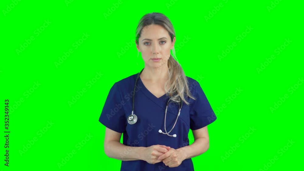 4K portrait of female nurse doctor on green screen isolated with chroma ...