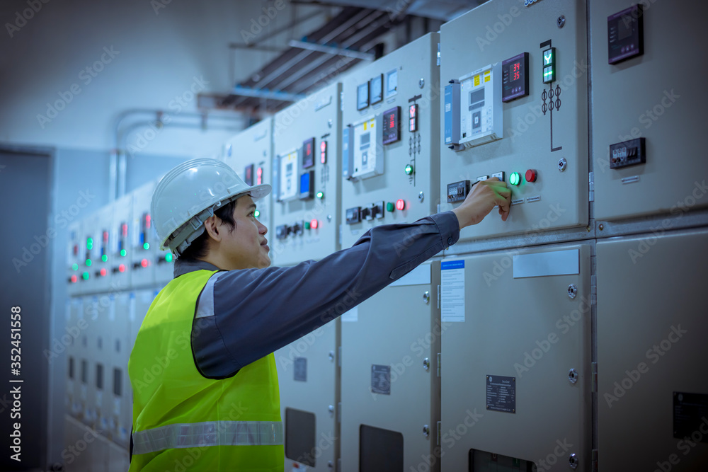 The engineer checking and inspecting at MDB panel.he working with ...