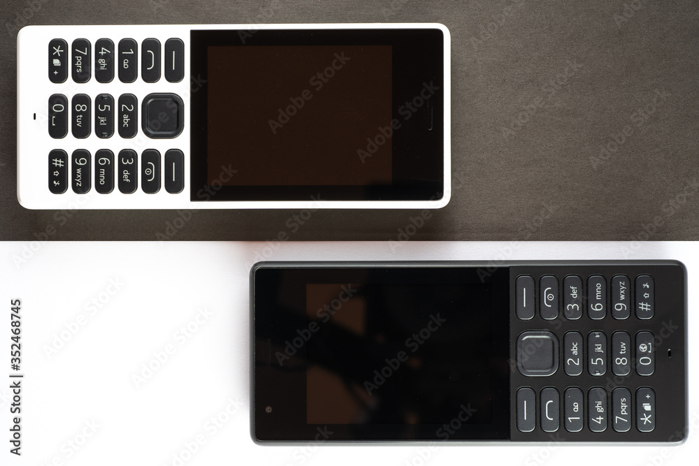Old cell phones on black and white background. Stock Photo | Adobe Stock