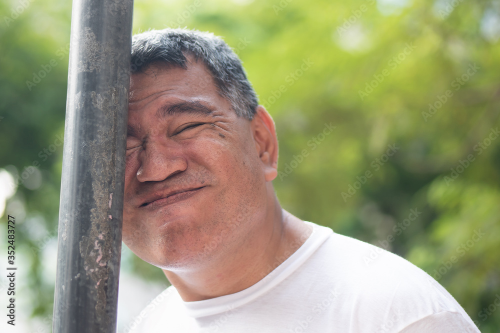 unlucky careless old senior man hitting his head with iron pole ...