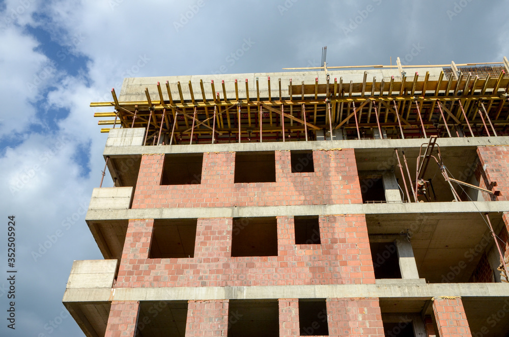 Building crane on construction site in city. Tower cranes against blue ...