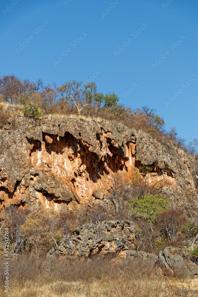 Wave like forms of ancient lava flows form an impressive Rock structure ...