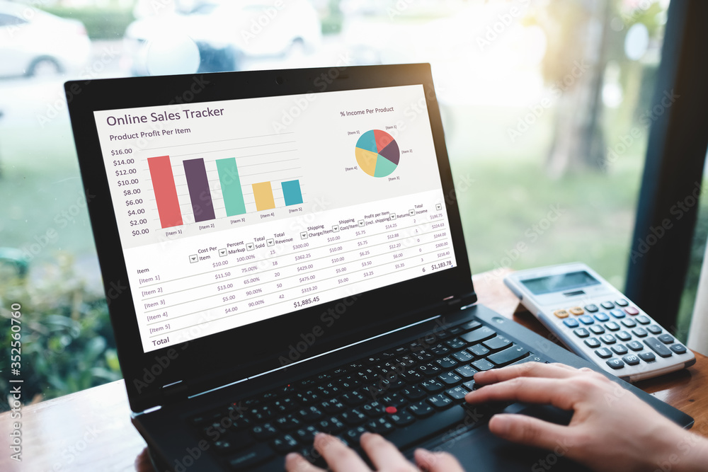Back view. Young female hipster freelancer sits in cafe at laptop ...
