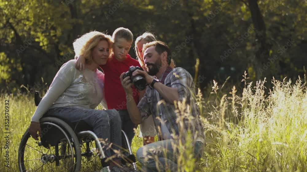 The father photographs the family with a professional camera. Family ...