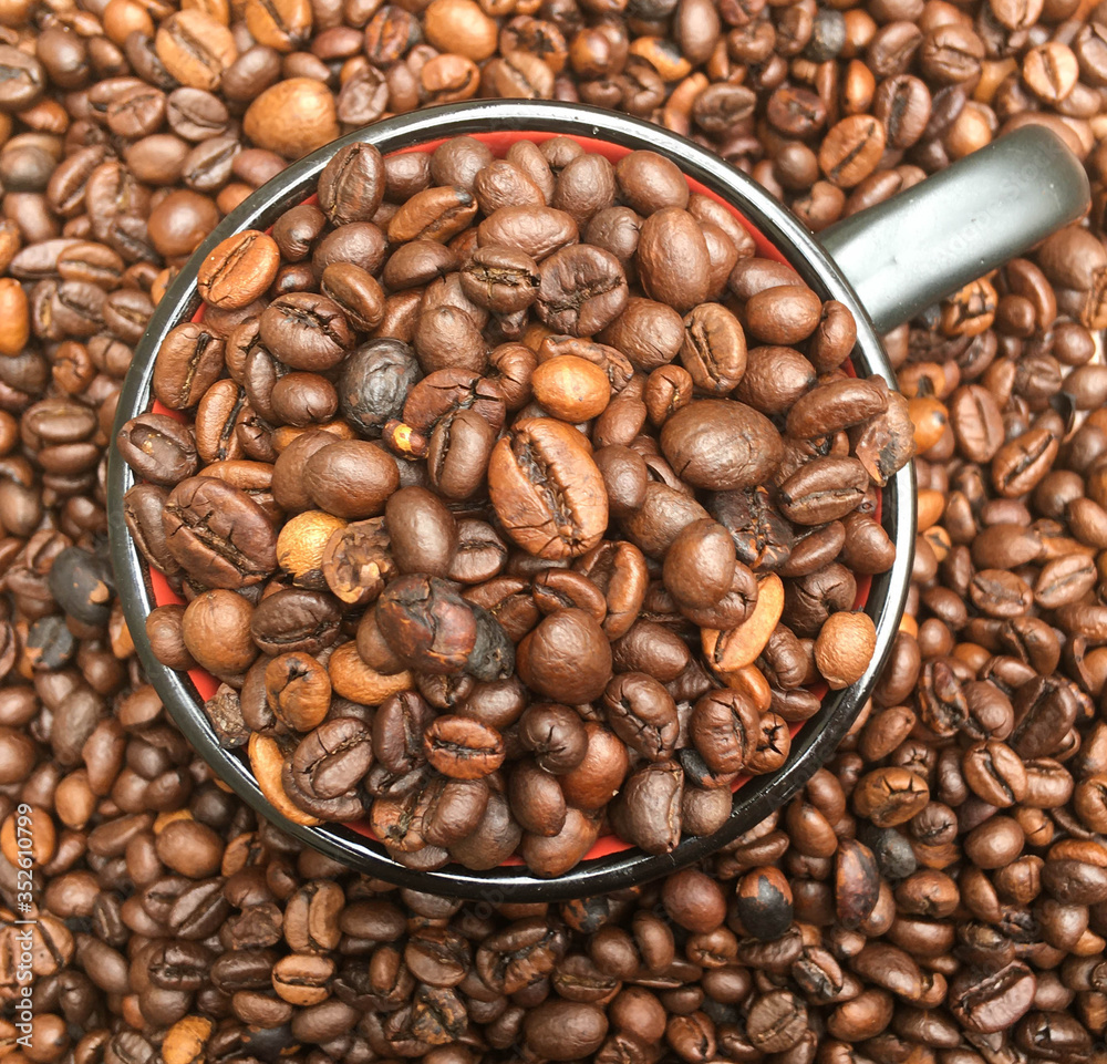 full bowl of roasted large coffee beans, coffee beans texture ...