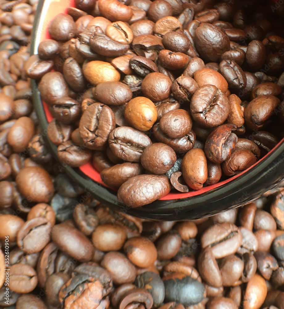 full bowl of roasted large coffee beans, coffee beans texture ...