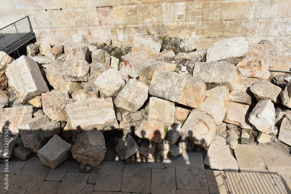Fallen stone blocks from a section of the wall surrounding the Temple ...