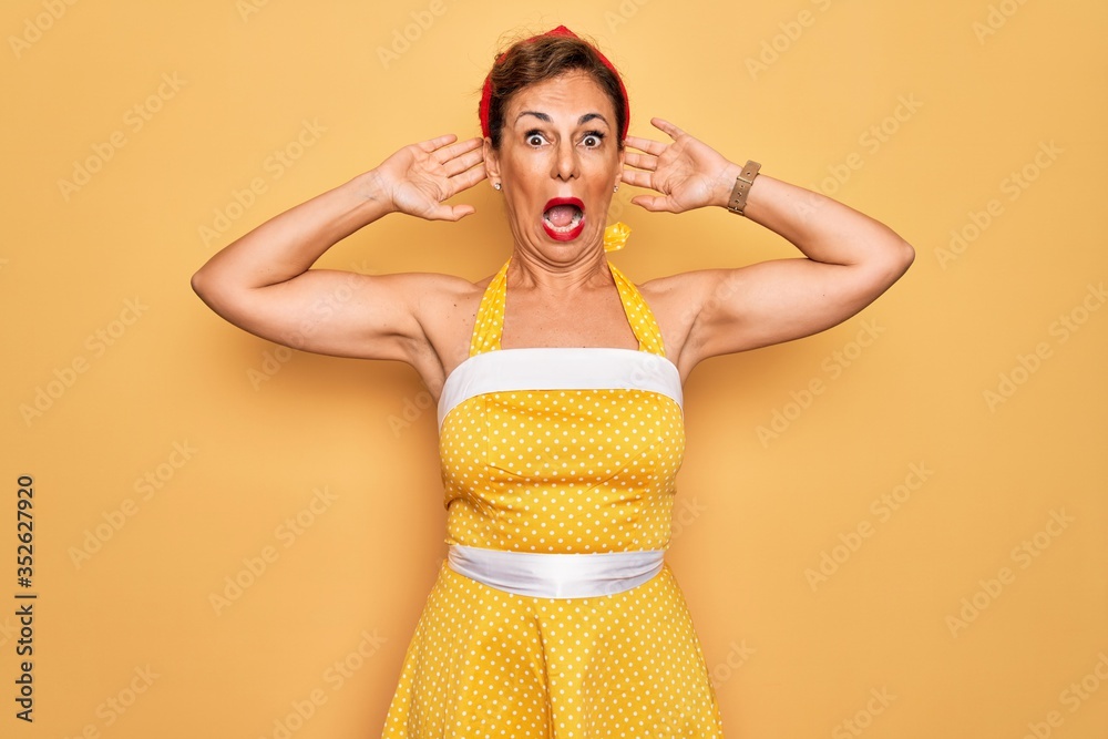 Middle age senior pin up woman wearing 50s style retro dress over ...