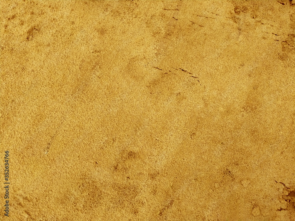 Yellow sand is wet. Dry soil texture and background. Background of red ...
