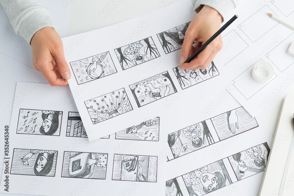 Hands of the artist draw a storyboard on paper. Storytelling. Story ...