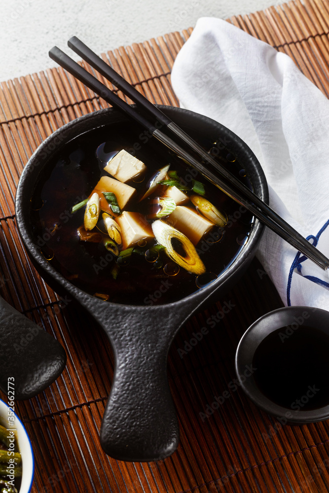 Japanese breakfast with miso soup, onigiri and vegetables in sweet and ...