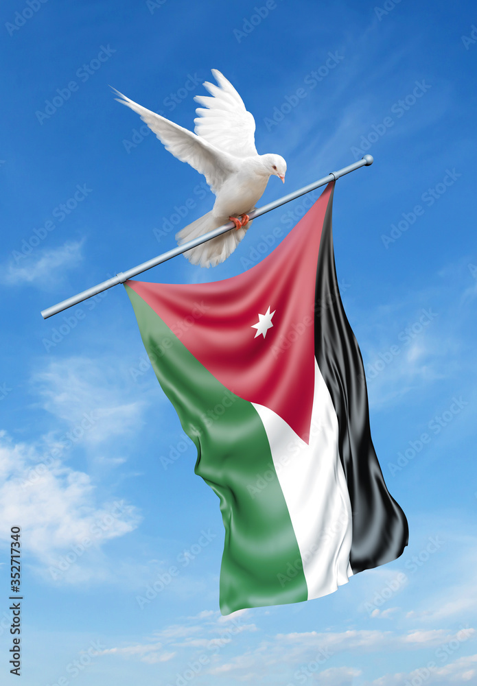 Jordan flag on a pole is carried by a bird while flying against a blue ...