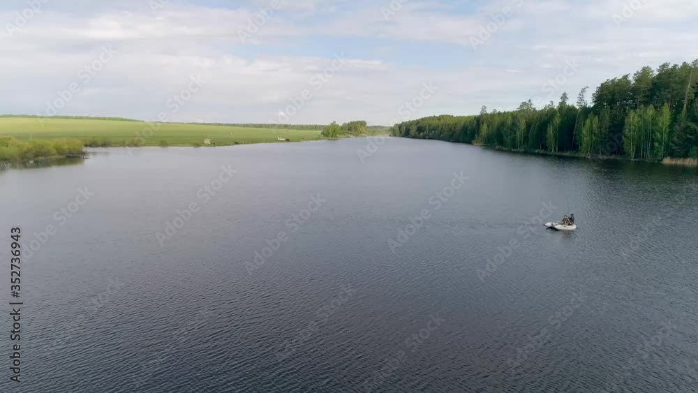 05. Aerial view of small lake with equipped fishing piers. Two ...