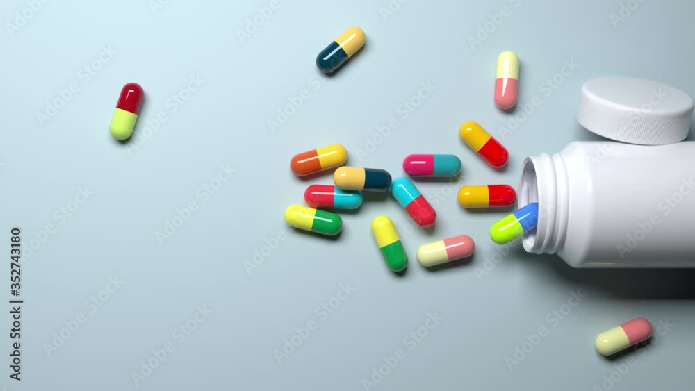 medicines, multi-colored capsules pour out of the jar and fall asleep ...