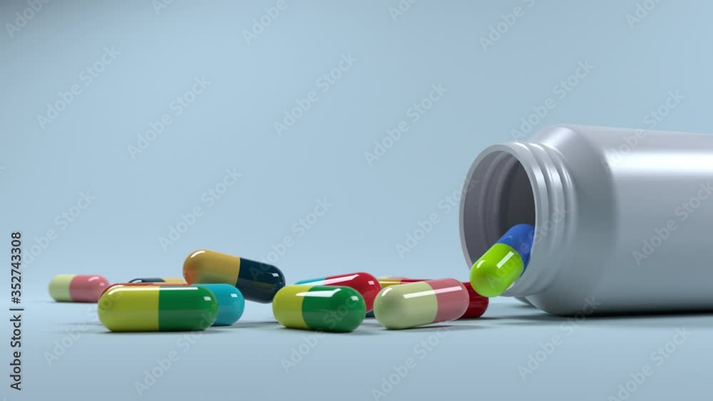 medicines, multi-colored capsules pour out of the jar and fall asleep ...