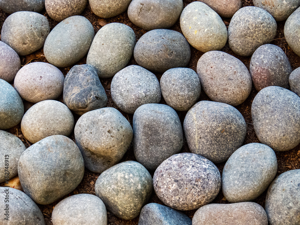 Mineral Background: Round pebbles close-up photo with different shapes ...
