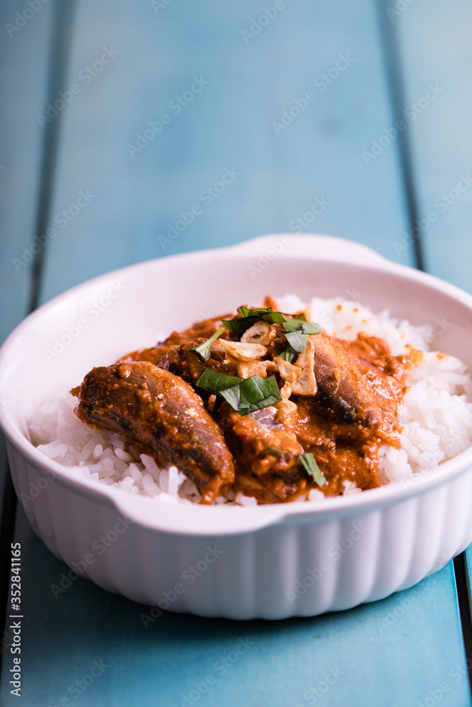 tomato sardines with crab fat on topped of rice or also known as aligue ...