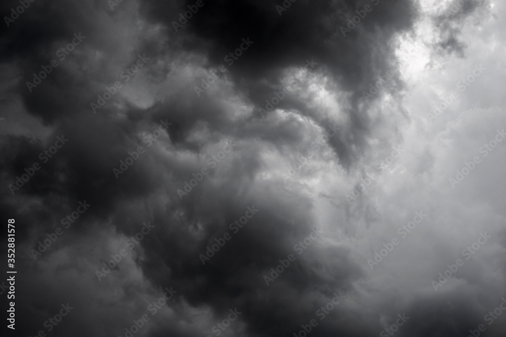 Dark sky and dramatic black cloud before rain.A tropical cyclone is a ...