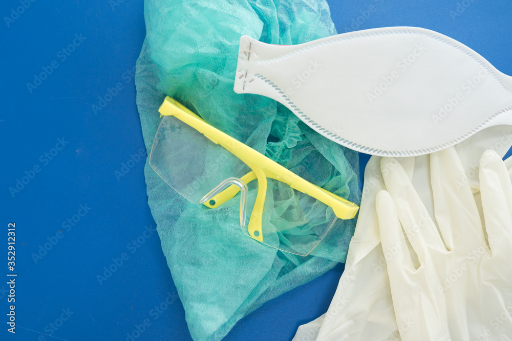 Gloves, face mask, glasses and sugical cap .Different medical ...