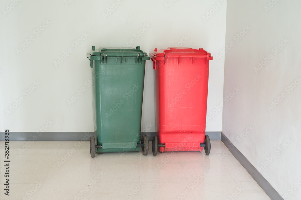 Green and red garbage bin in the hospital.Infection and general trash ...