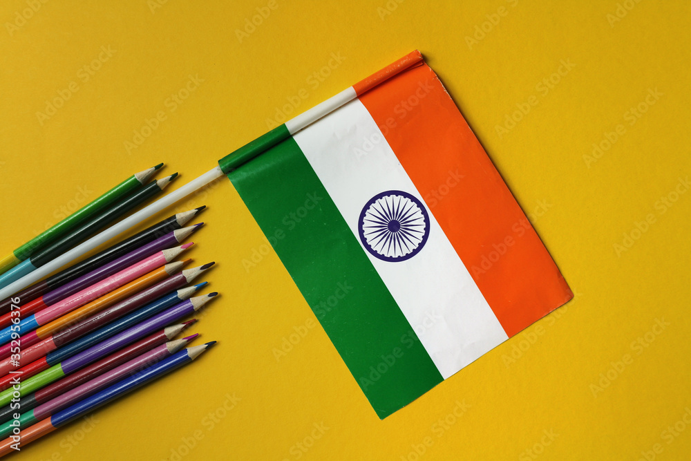 Colored pencils and indian flag on a yellow background. Stock Photo ...