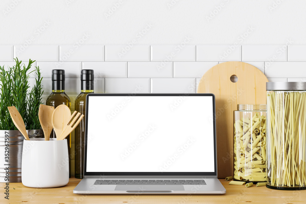 Kitchen worktop with blank laptop screen. Modern kitchen interior ...