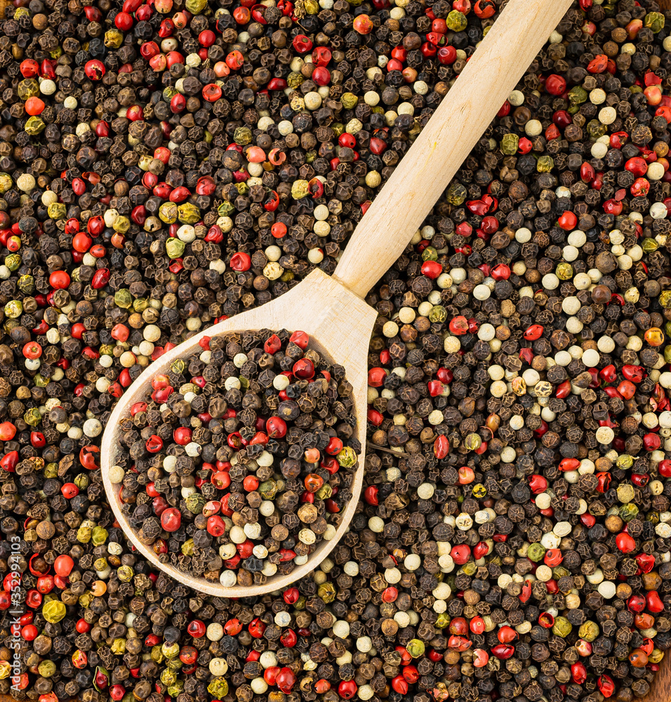Five Peppercorn mix, five varieties in a wooden spoon for a food ...