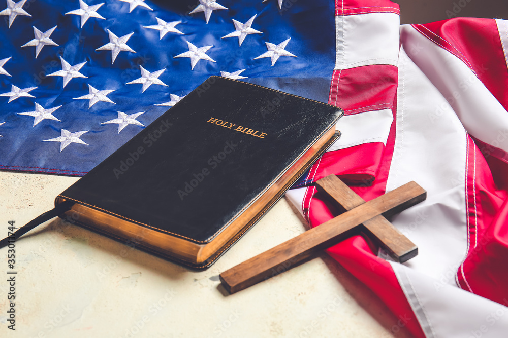 Holy Bible, cross and USA flag on light background Stock Photo | Adobe ...