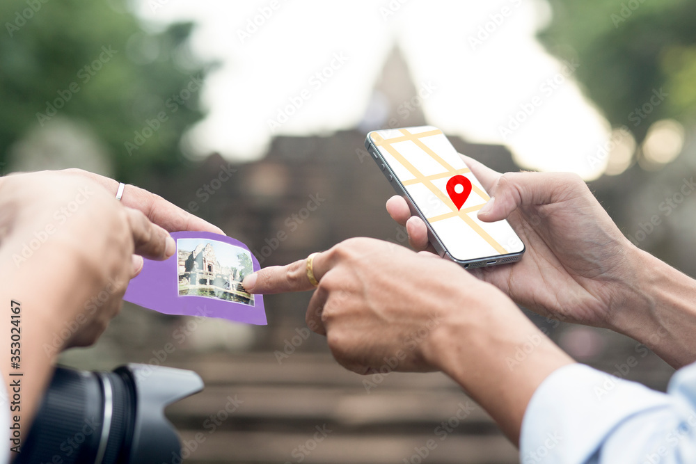Hand holding smartphone with application map and search follow ticket ...