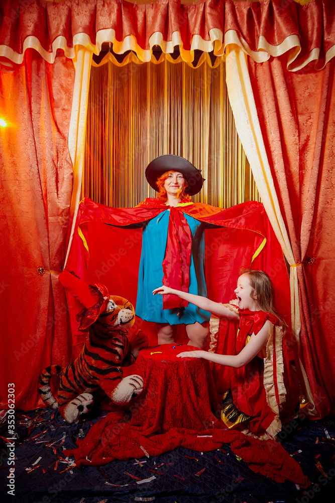 Family during a stylized theatrical circus photo shoot in a beautiful ...