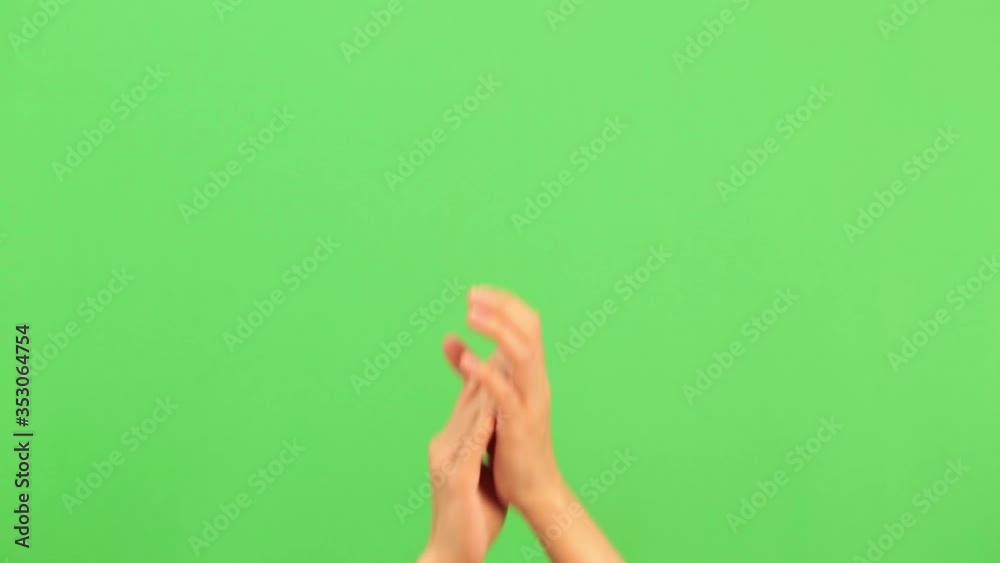 Hands are clapping on green screen background. Female hands clapping on ...