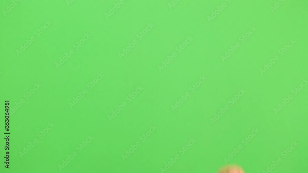 Palm of right male hand raising on green screen, chroma key. Closeup ...