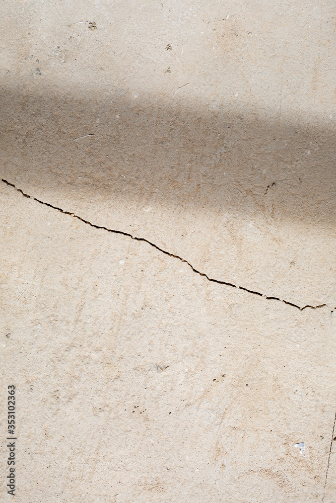 Cracks in the concrete cement screed on the floor after repair. The ...