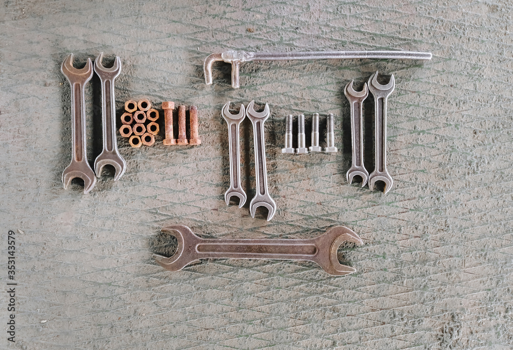 A set of metal parts for work: Wrenches, welded auxiliary keys, rusty ...