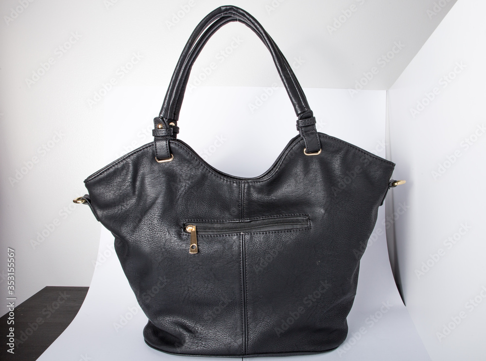 London, England, 20/02/2020 Black real authentic leather bag shot on a ...