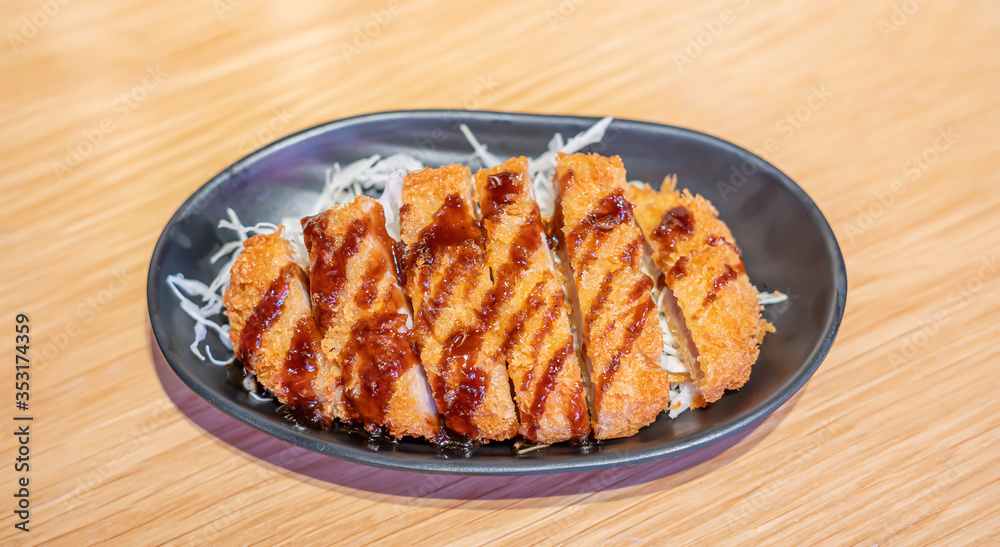 Japanese style pork cutlet tonkatsu Below there is a Chinese cabbage ...