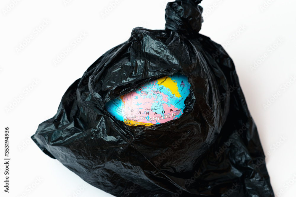 World Globe inside plastic bag you can see in hole different parts of ...